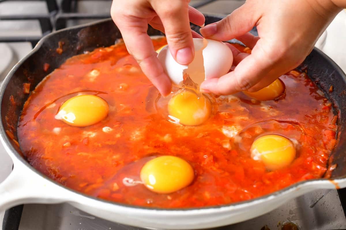 Shakshuka - Bright Breakfast Dish with Eggs in a Chunky Tomato Sauce